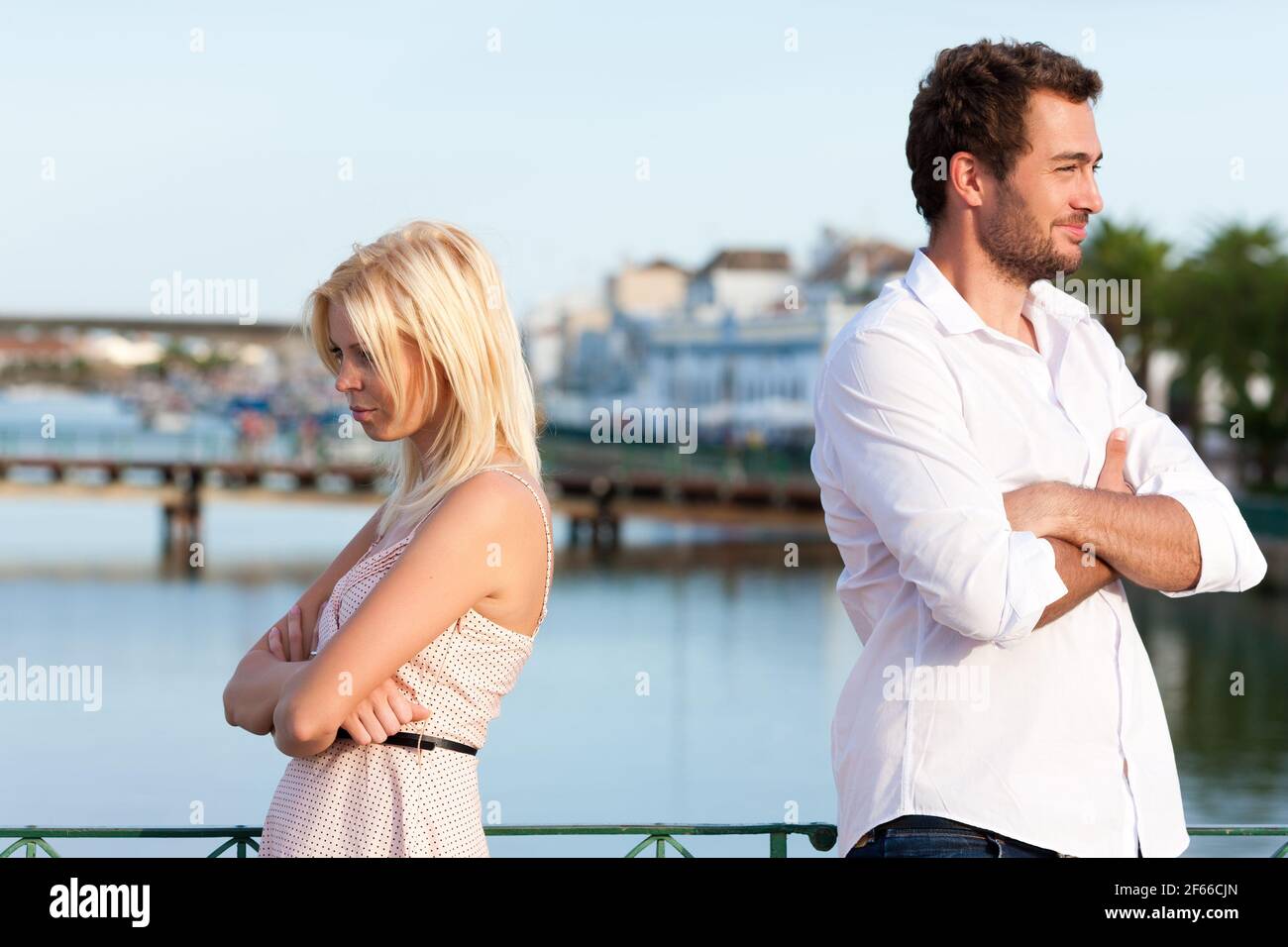 Couple having a discussion in summer in their vacation Stock Photo - Alamy