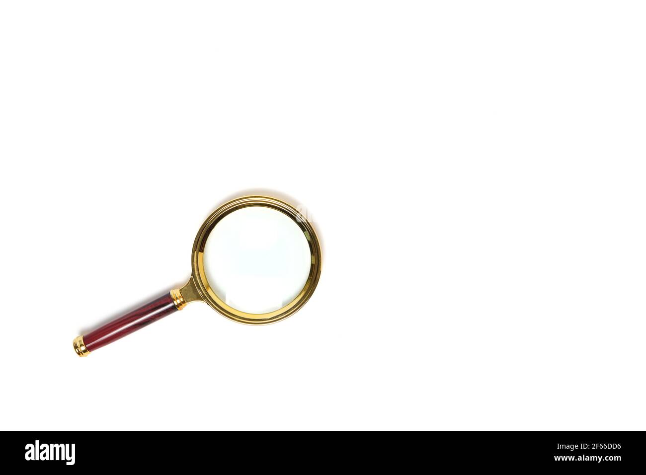 Gold plated magnifier with red handle on white background, isolate ...