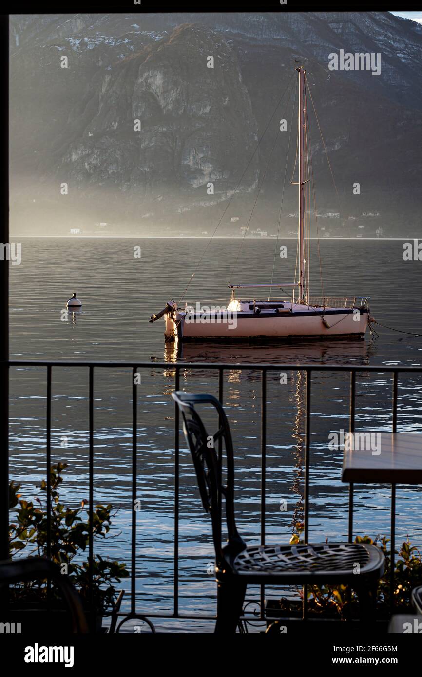 Sailboat on Lake Como at sunset, in Italy. Autumn Stock Photo - Alamy