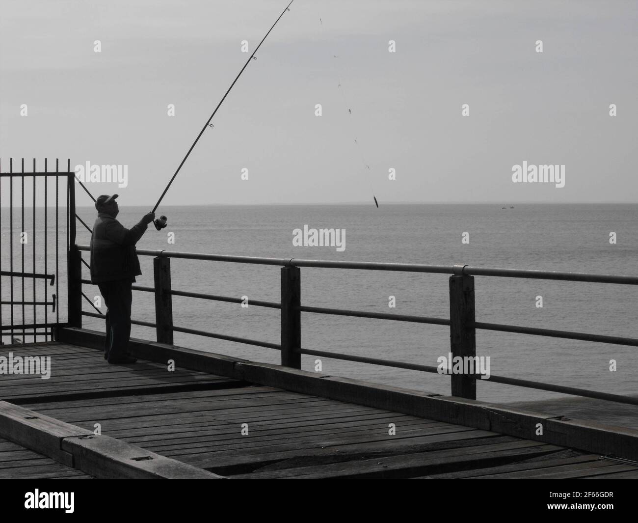 Old man Fishing in Sea Stock Photo - Alamy