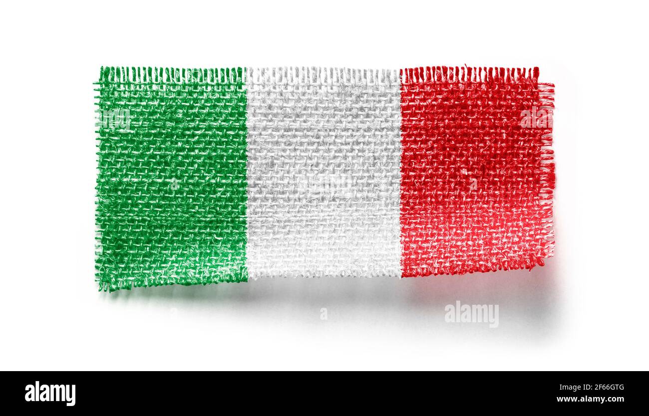 Italy flag on a piece of cloth on a white background Stock Photo - Alamy