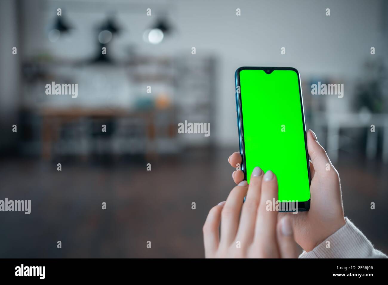 Woman using clicking phone green hi-res stock photography and images ...