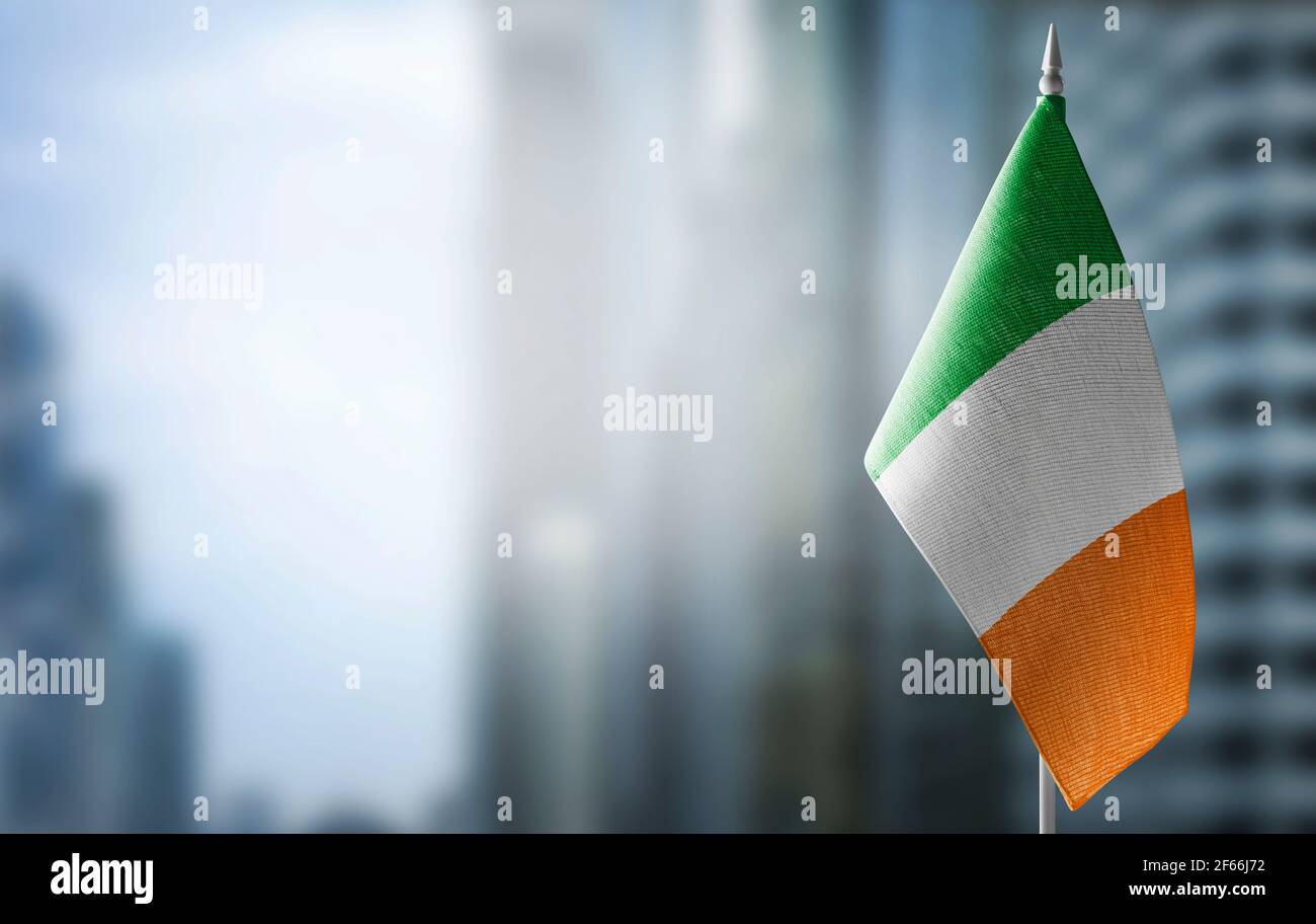 A small flag of Ireland on the background of a blurred background Stock ...