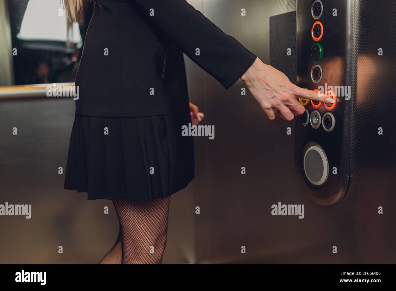 Closeup portrait of a female finger pushing elevator button Stock Photo ...
