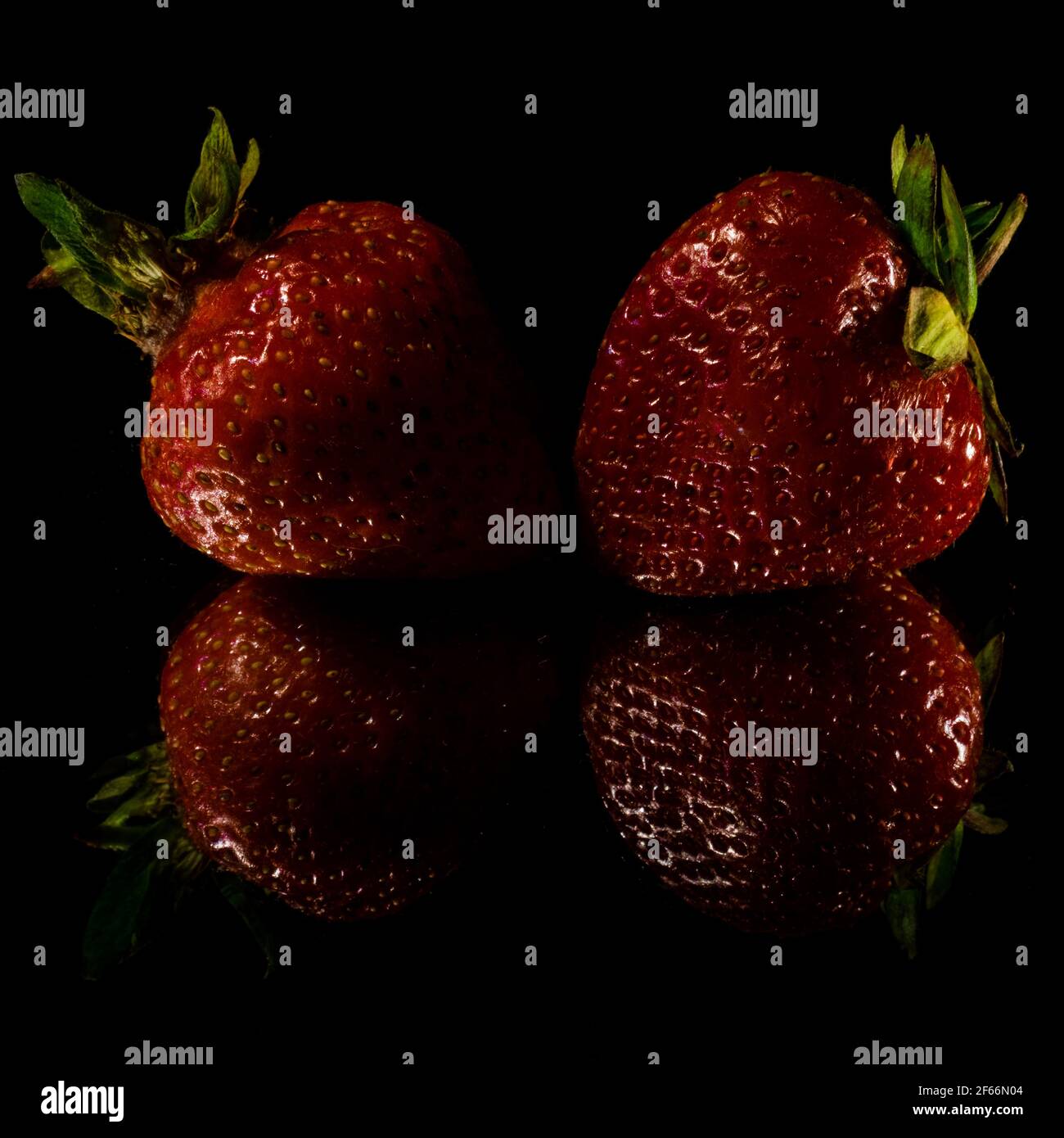 Two strawberries hi-res stock photography and images - Alamy