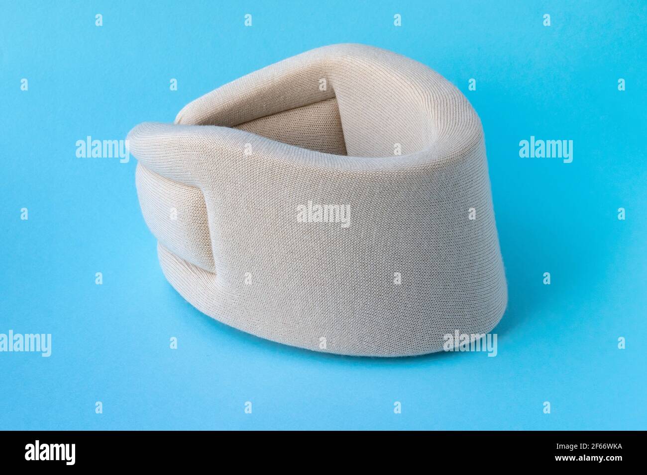 Neck support brace on blue background. Soft surgical or cervical collar ...