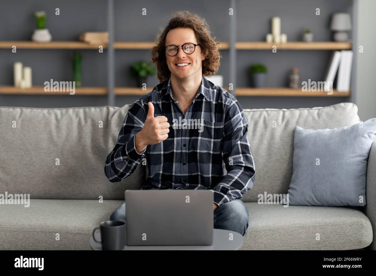 Businessman laptop happy thumbs up hi-res stock photography and images ...