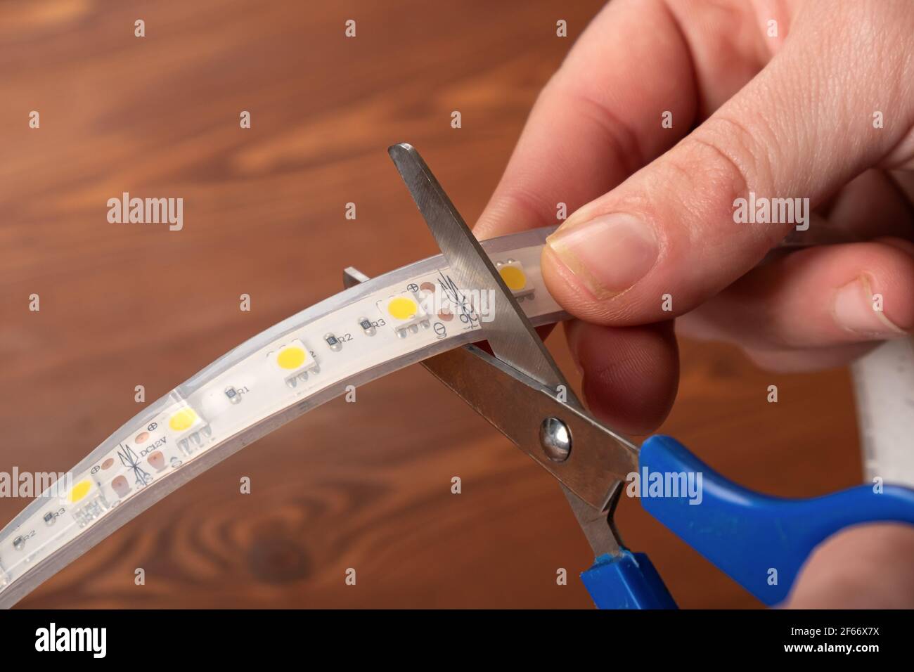 cutting off led strip,installation of diode lighting Stock Photo - Alamy