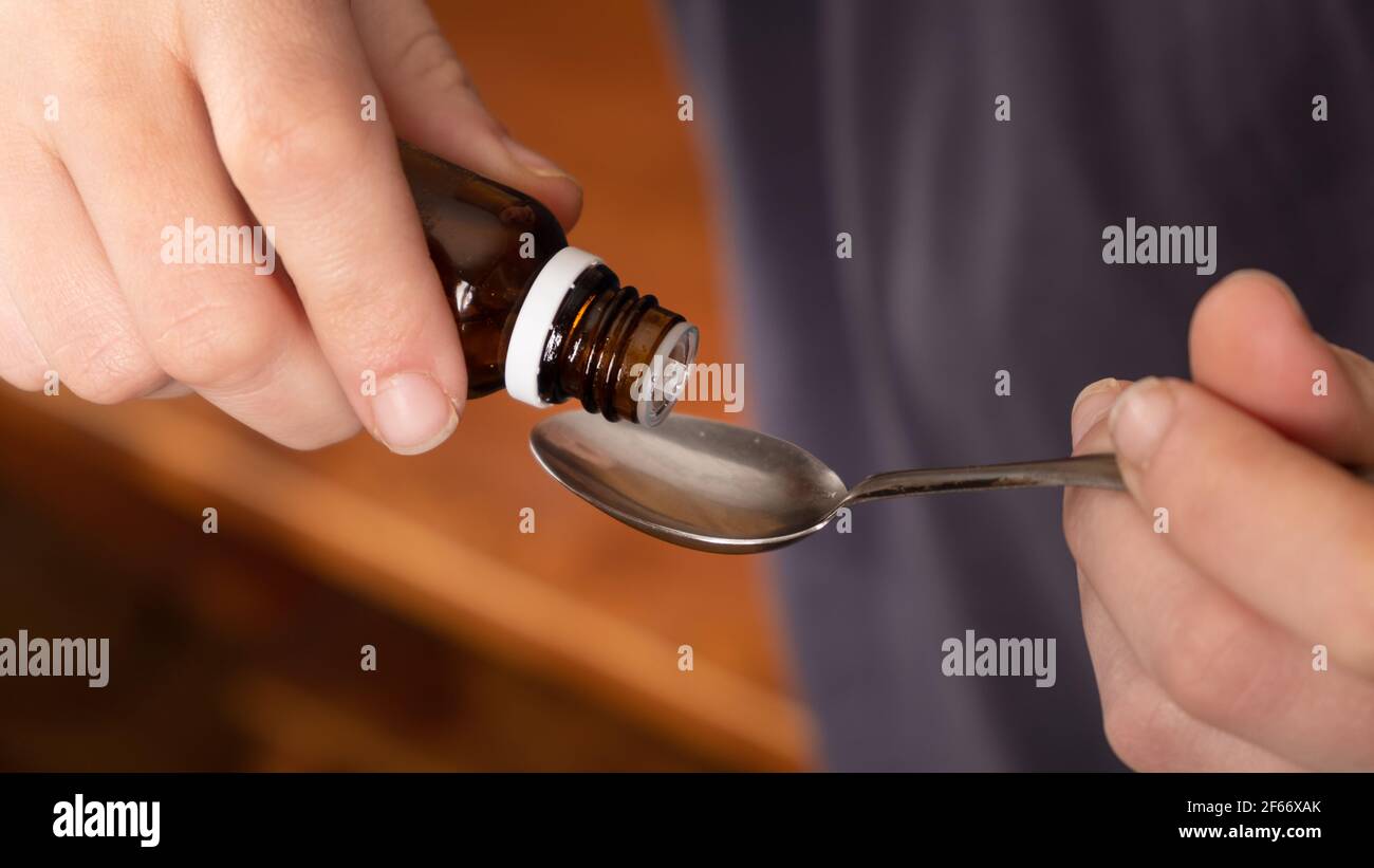 Medicine measure spoon hi-res stock photography and images - Alamy