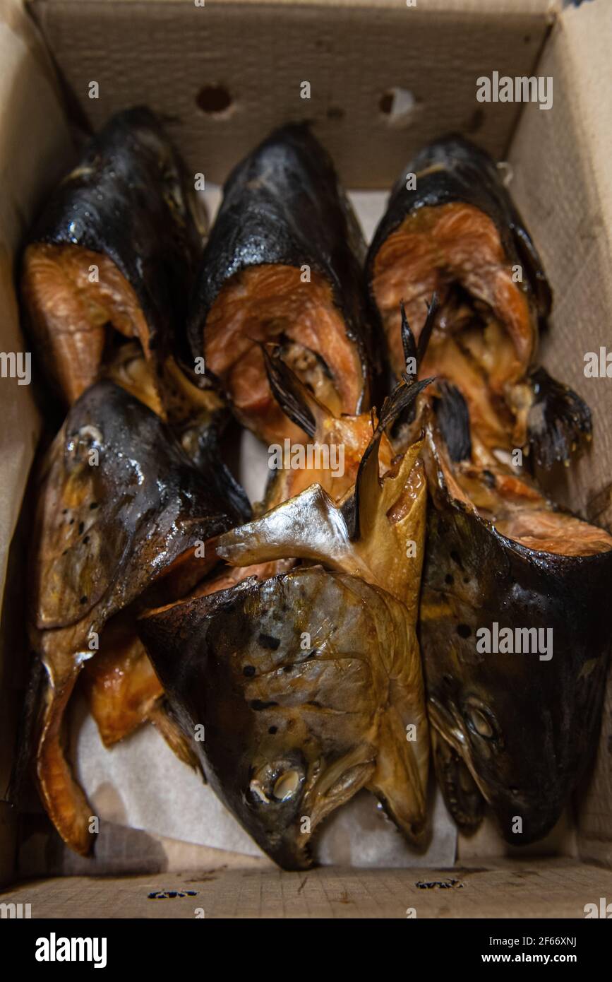 Smoked fish in craft paper box. Ready for delivery production. Smoked ...