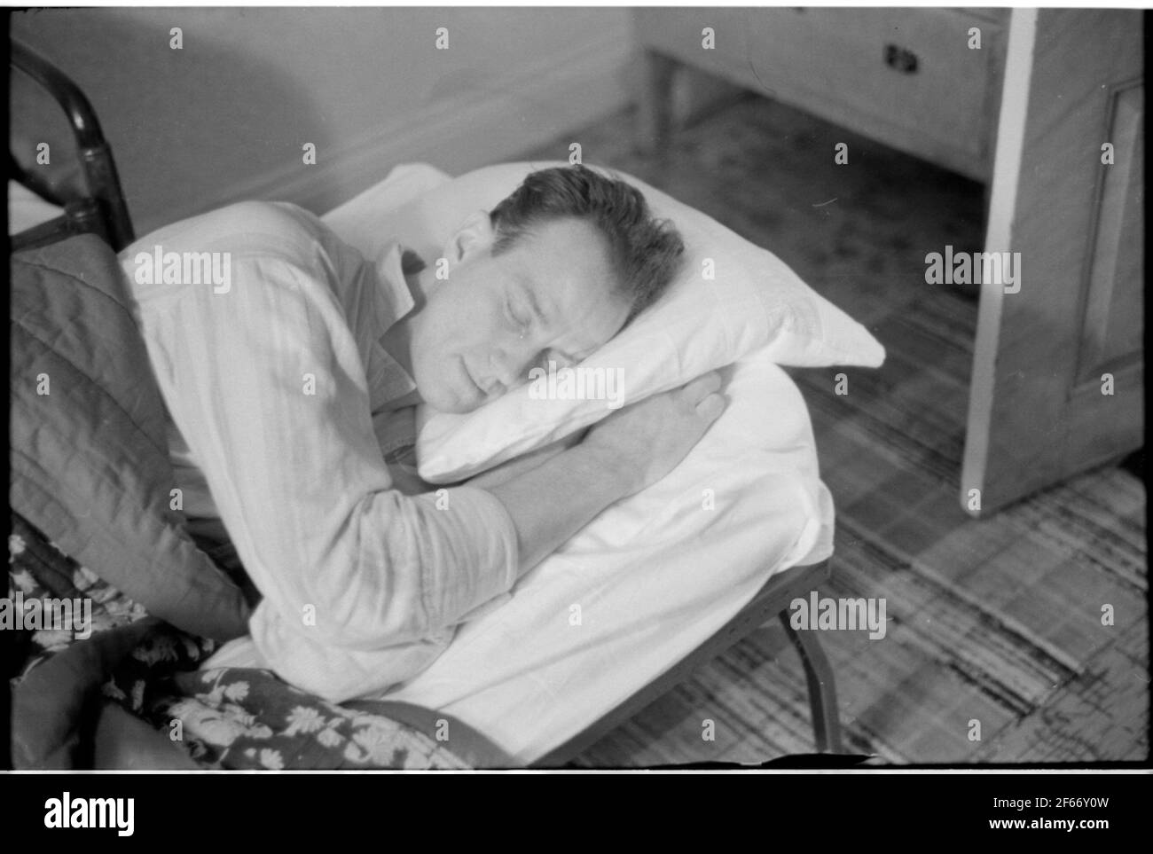 Sleeping man in bed Stock Photo - Alamy