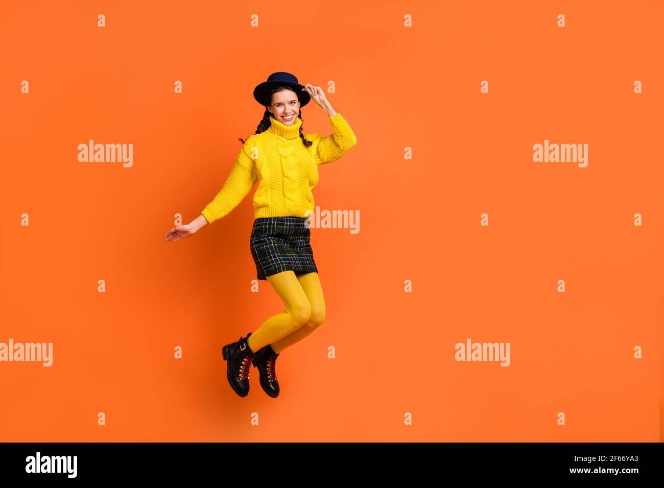 Full length body size view of pretty thin cheerful girl jumping posing ...