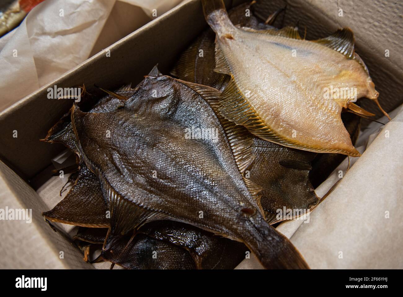 Smoked fish in craft paper box. Ready for delivery production. Smoked ...