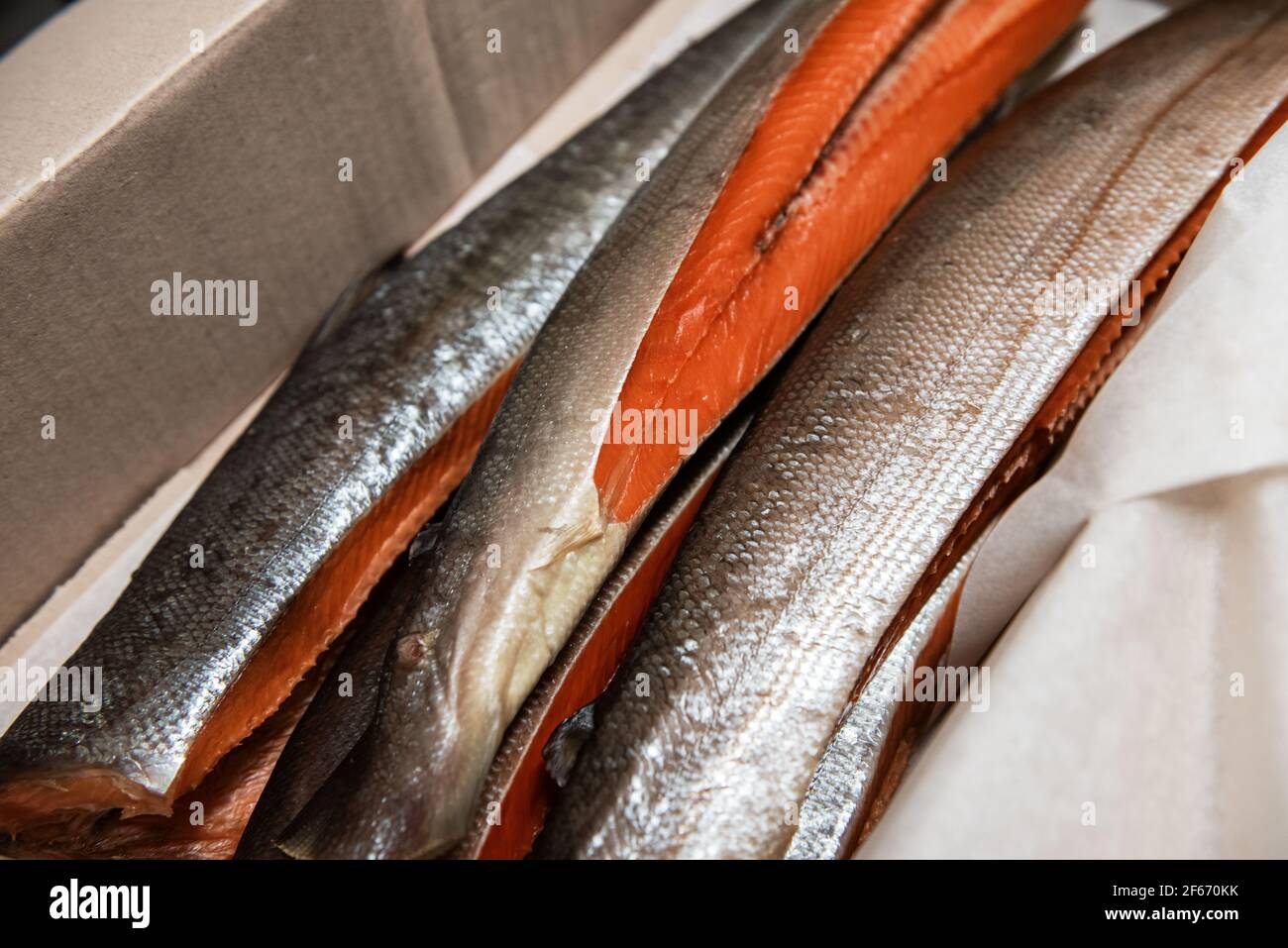 Smoked fish in craft paper box. Ready for delivery production. Smoked ...