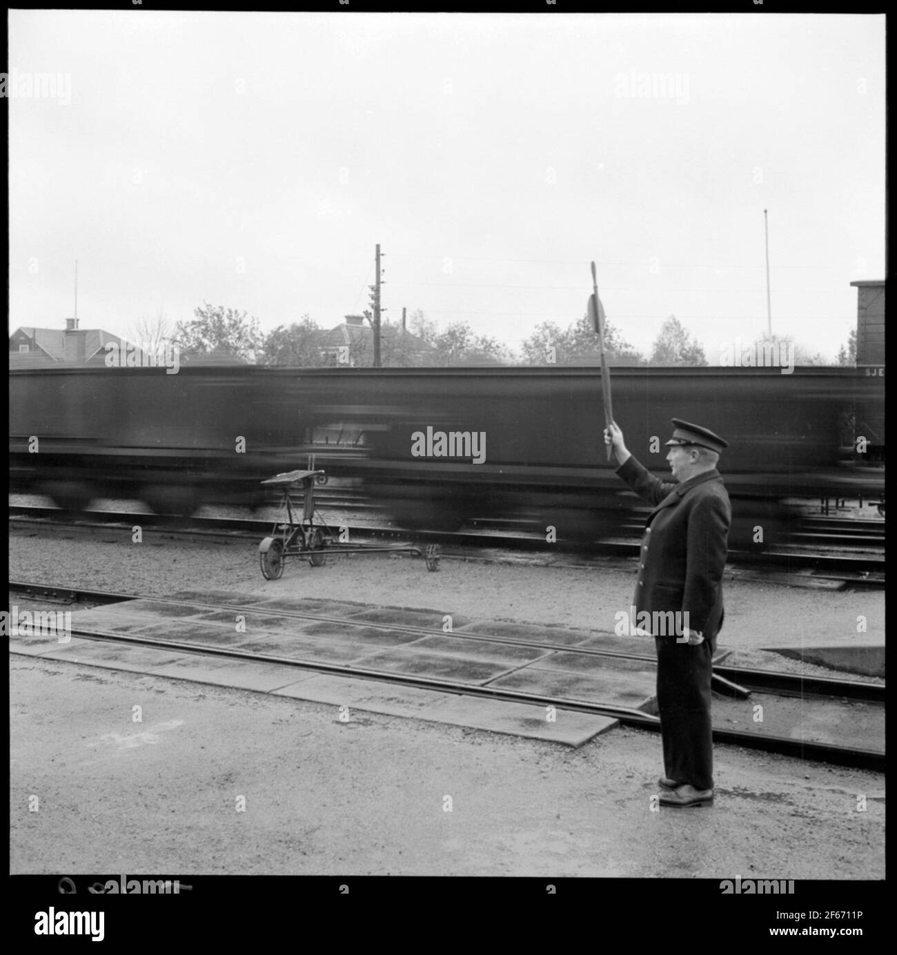 Railway officer provides signal Stock Photo - Alamy