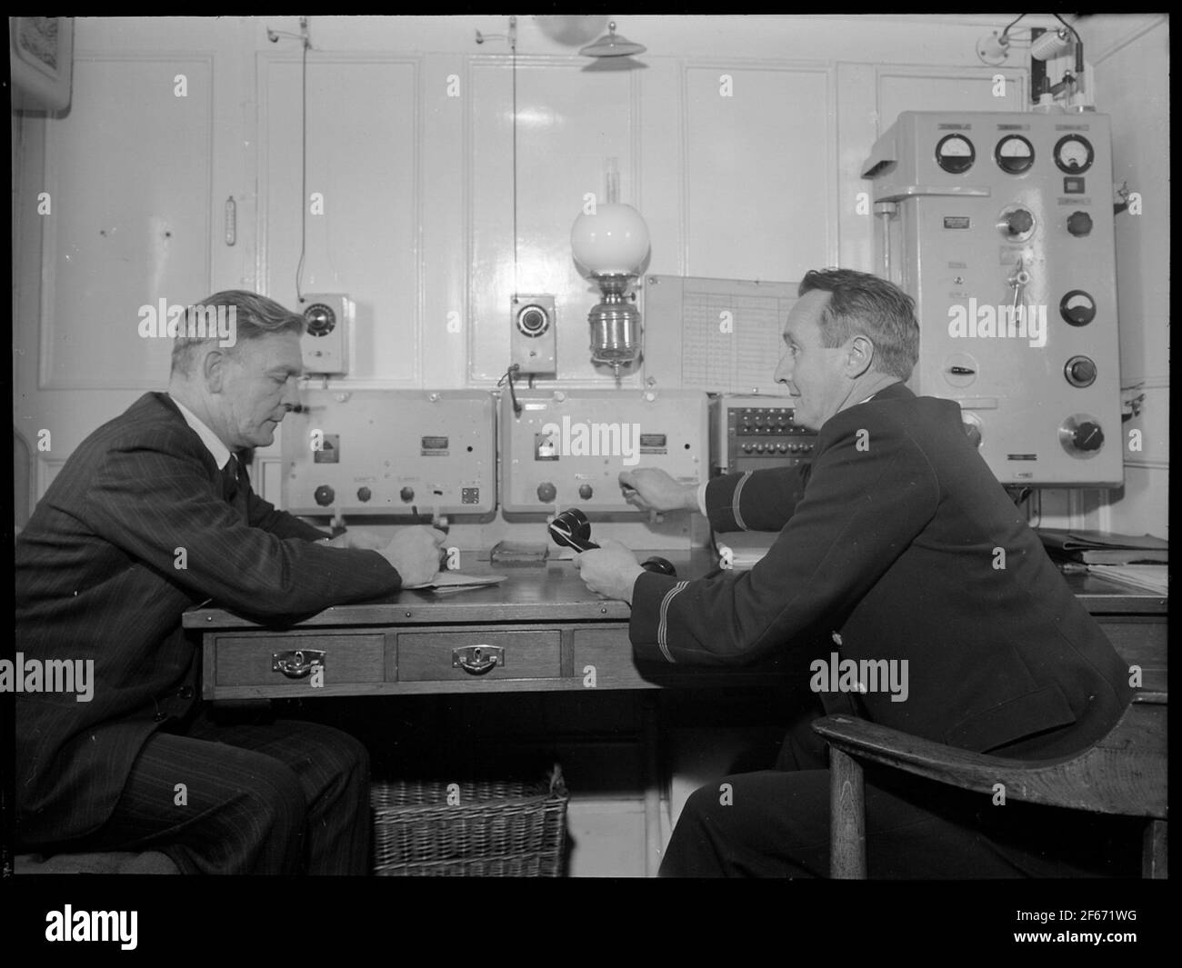 Two unknown men portrayed during work Stock Photo - Alamy