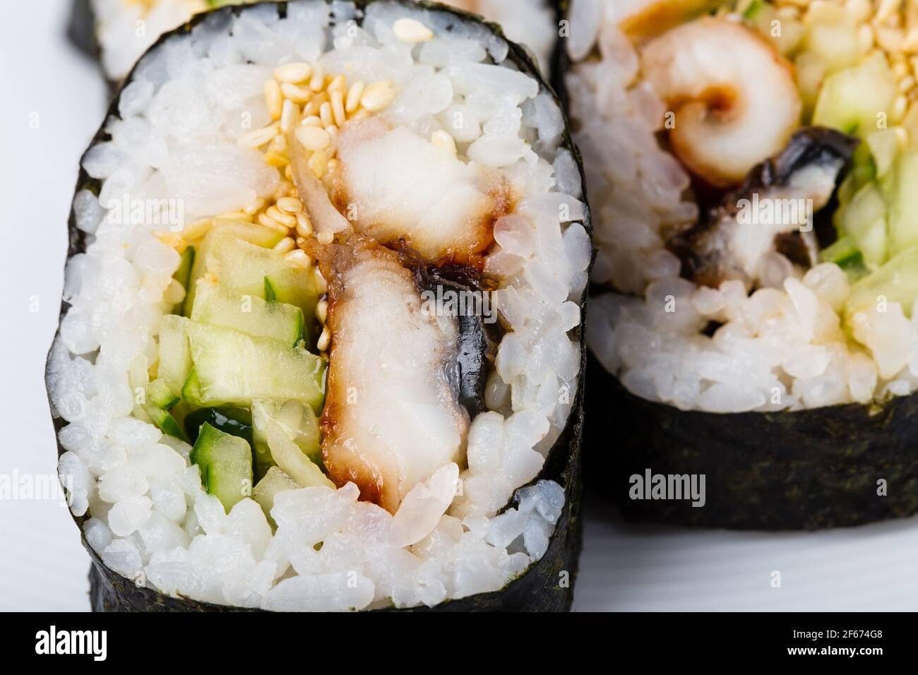 Delicious smoked unagi roll with cucumber and sesame seeds. Macro ...