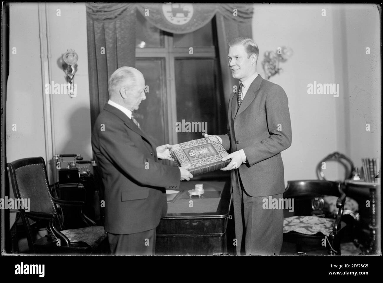 Count Cronstedt submits an album to Major Werner Stock Photo - Alamy