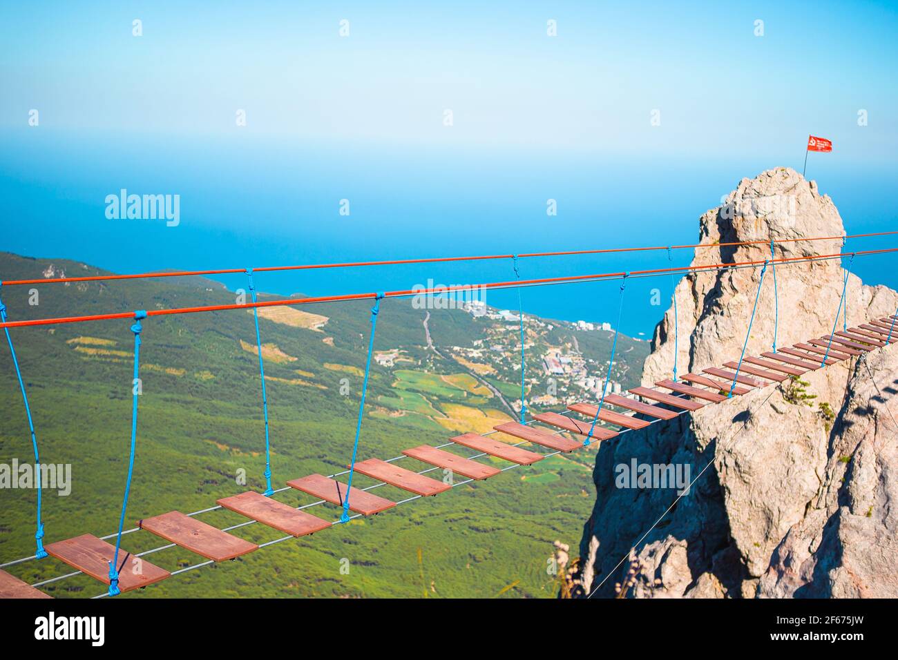 Suspension bridge in the mountains Stock Photo - Alamy