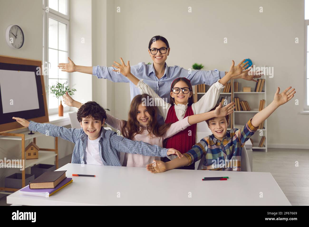 Happy cheerful pupil children and teacher positive portrait in ...