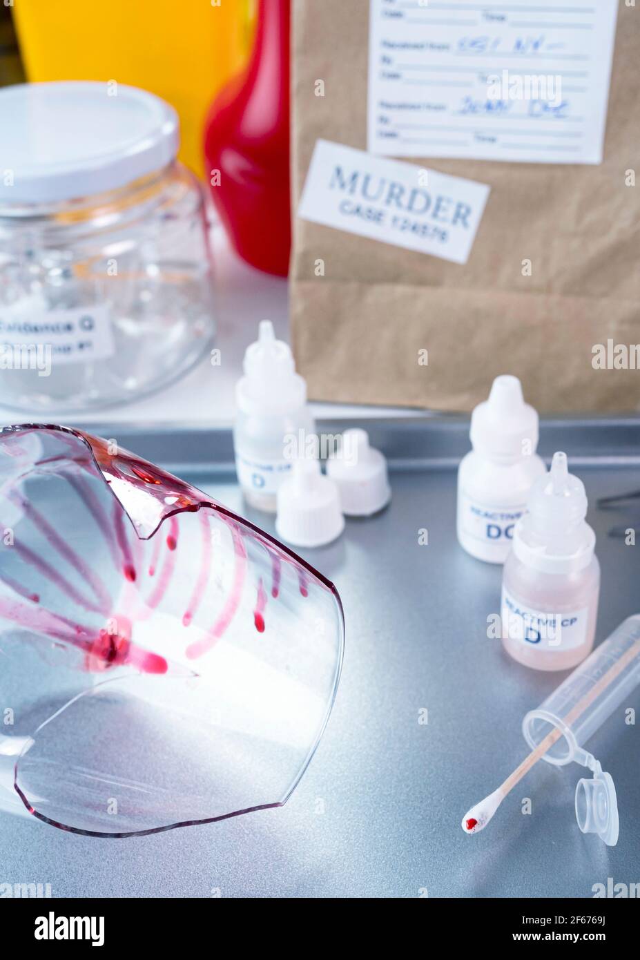 Blood-stained glass sample in an evidence cup, concept image Stock ...