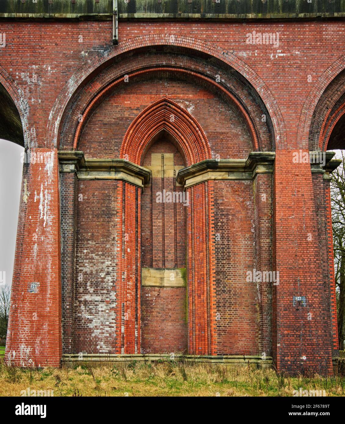 An ornate arch, filled to strengthen the construction near the roadway ...