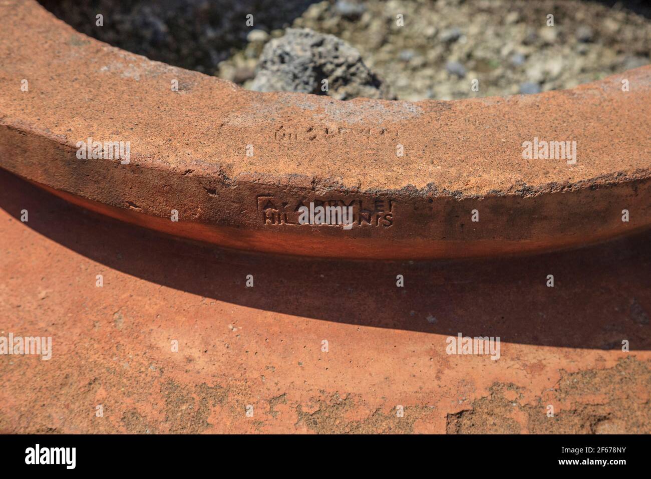 The makers stamp on a Roman terracotta clay pot in Pompeii, Italy Stock ...