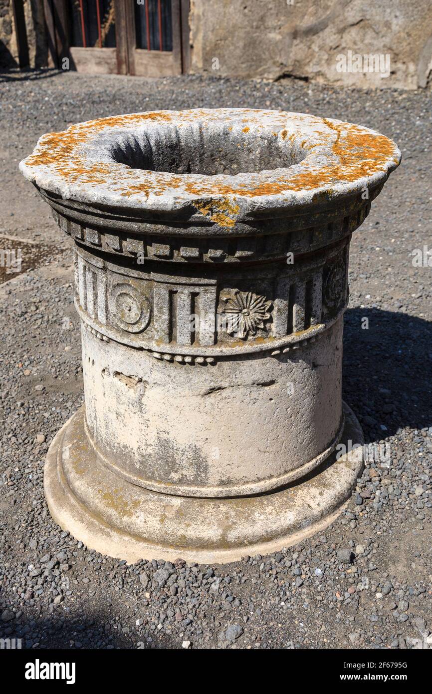 A Puteal wellhead next to an impluvium (pool) for drawing water from ...