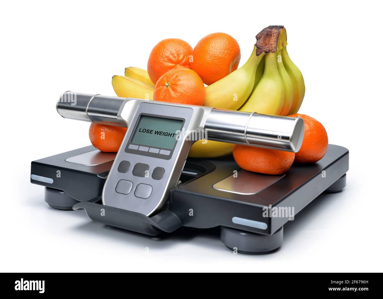 Scale with fresh fruits isolated on a white background. Lose weight ...