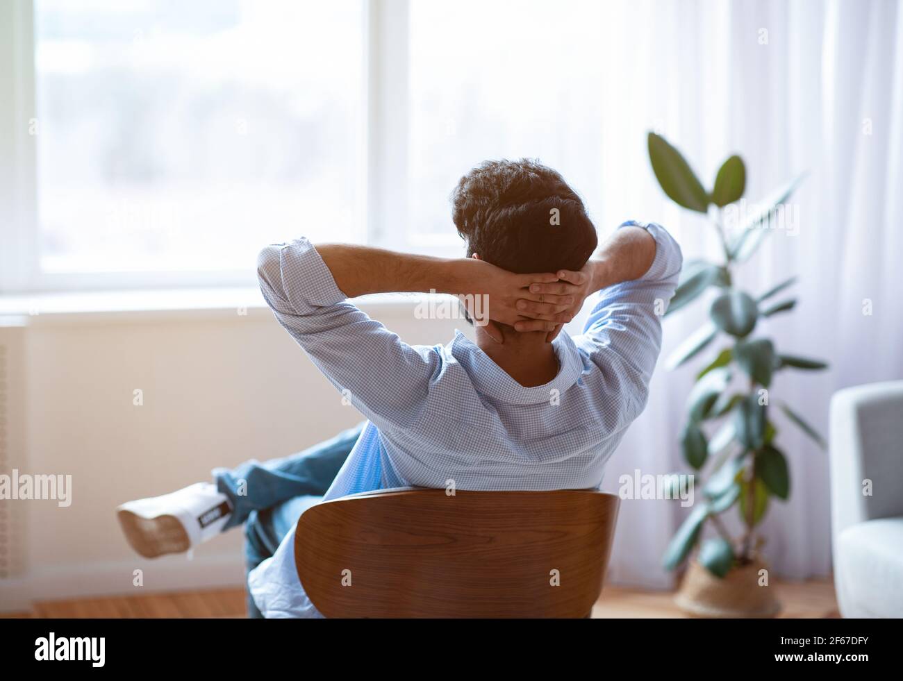 Person leaning back on chair hi-res stock photography and images - Alamy