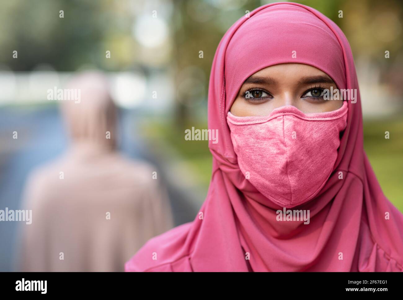 Arab Young Lady Wearing Protective Face Mask Posing Outdoors Stock ...