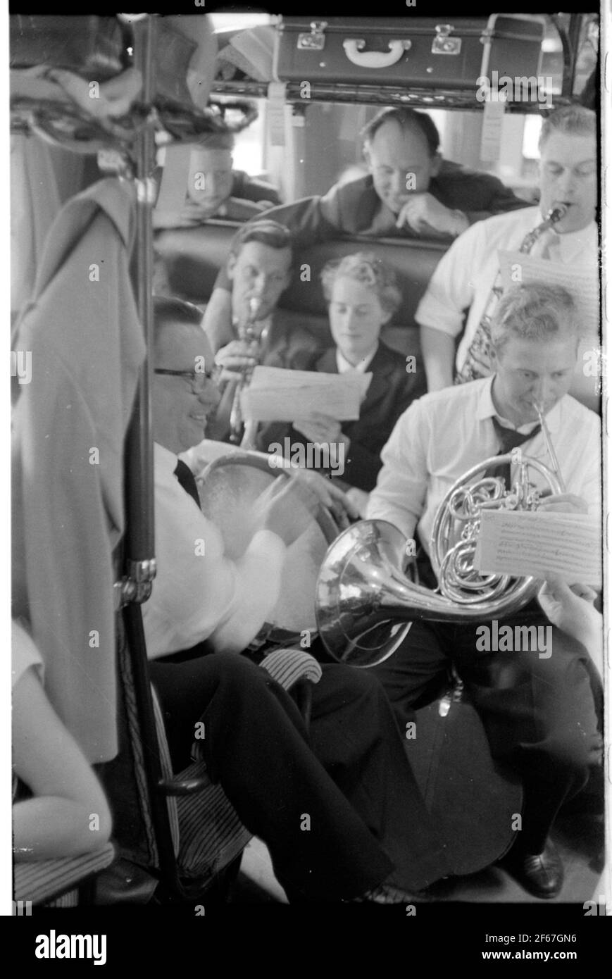 Entertainment on board train home Stock Photo - Alamy