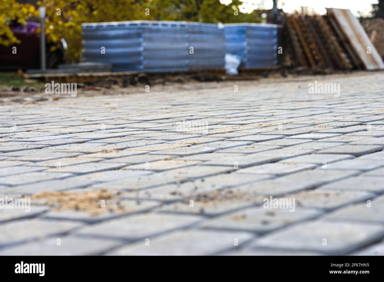 new pavement of paving slabs, new street being paved Stock Photo - Alamy