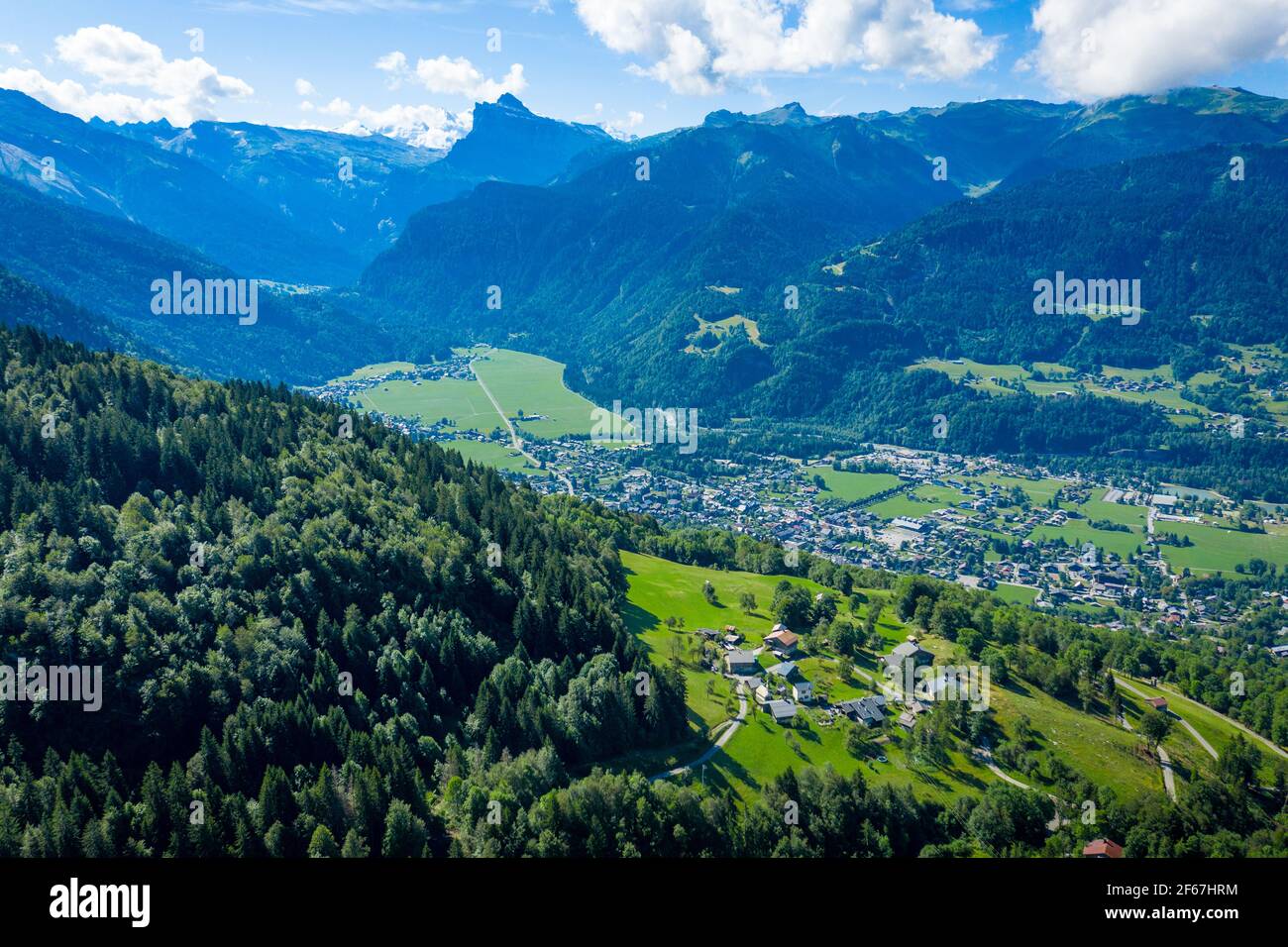 Aerial view of wide valley with towns or villages between high ridges ...
