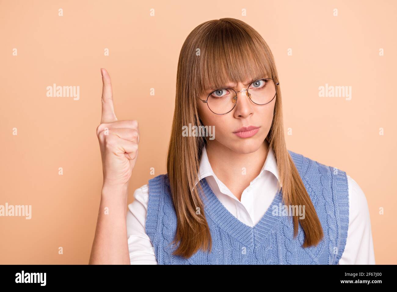 Photo portrait of woman teaching keeping finger up reminding isolated ...