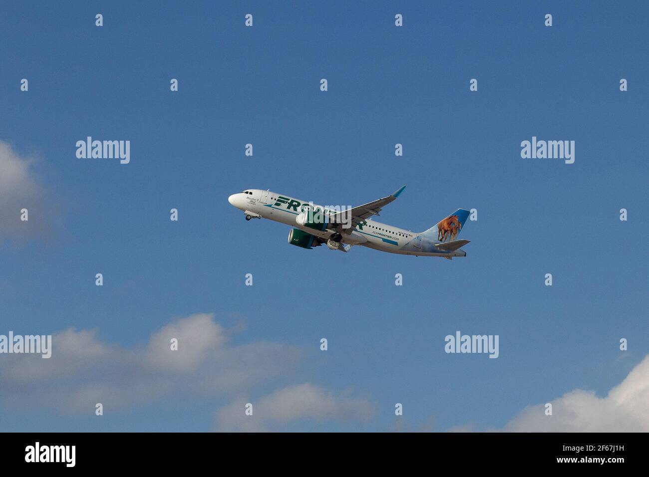 Frontier Airlines plane taking off from Denver International Airport ...