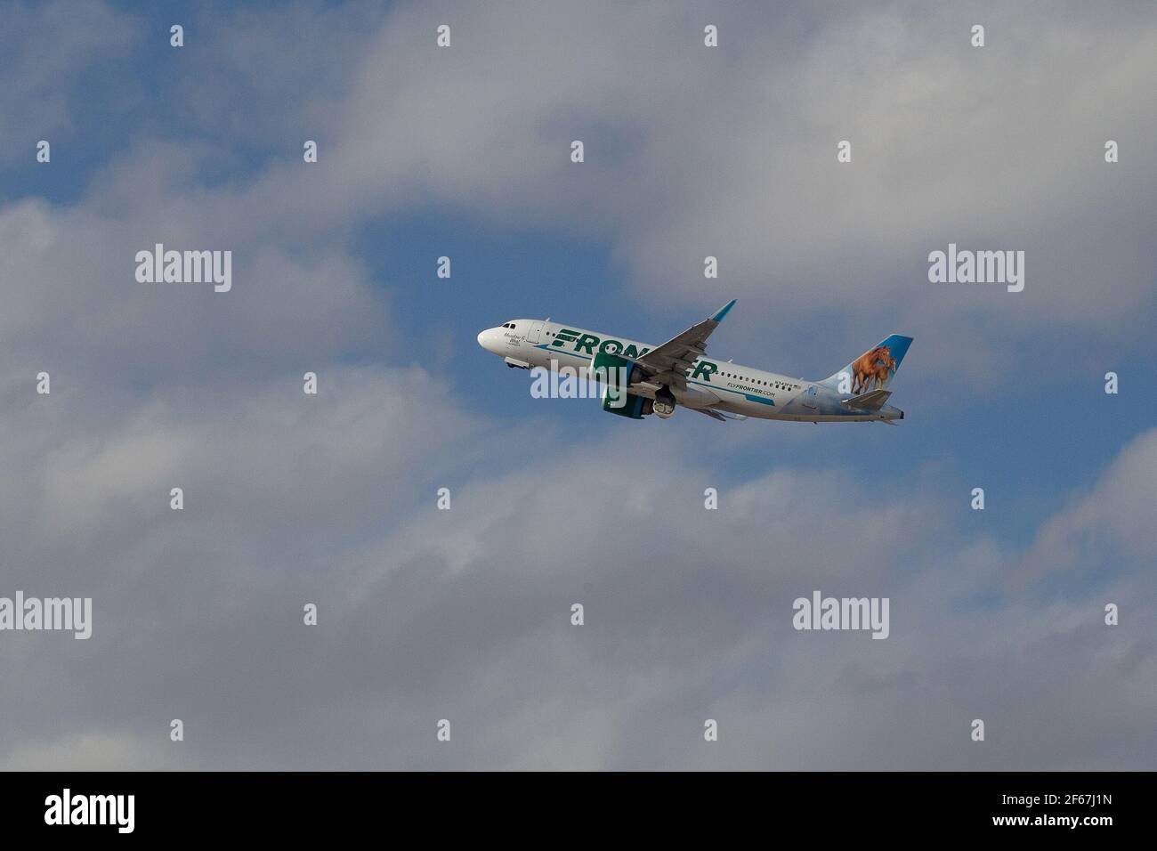 Frontier Airlines plane taking off from Denver International Airport ...