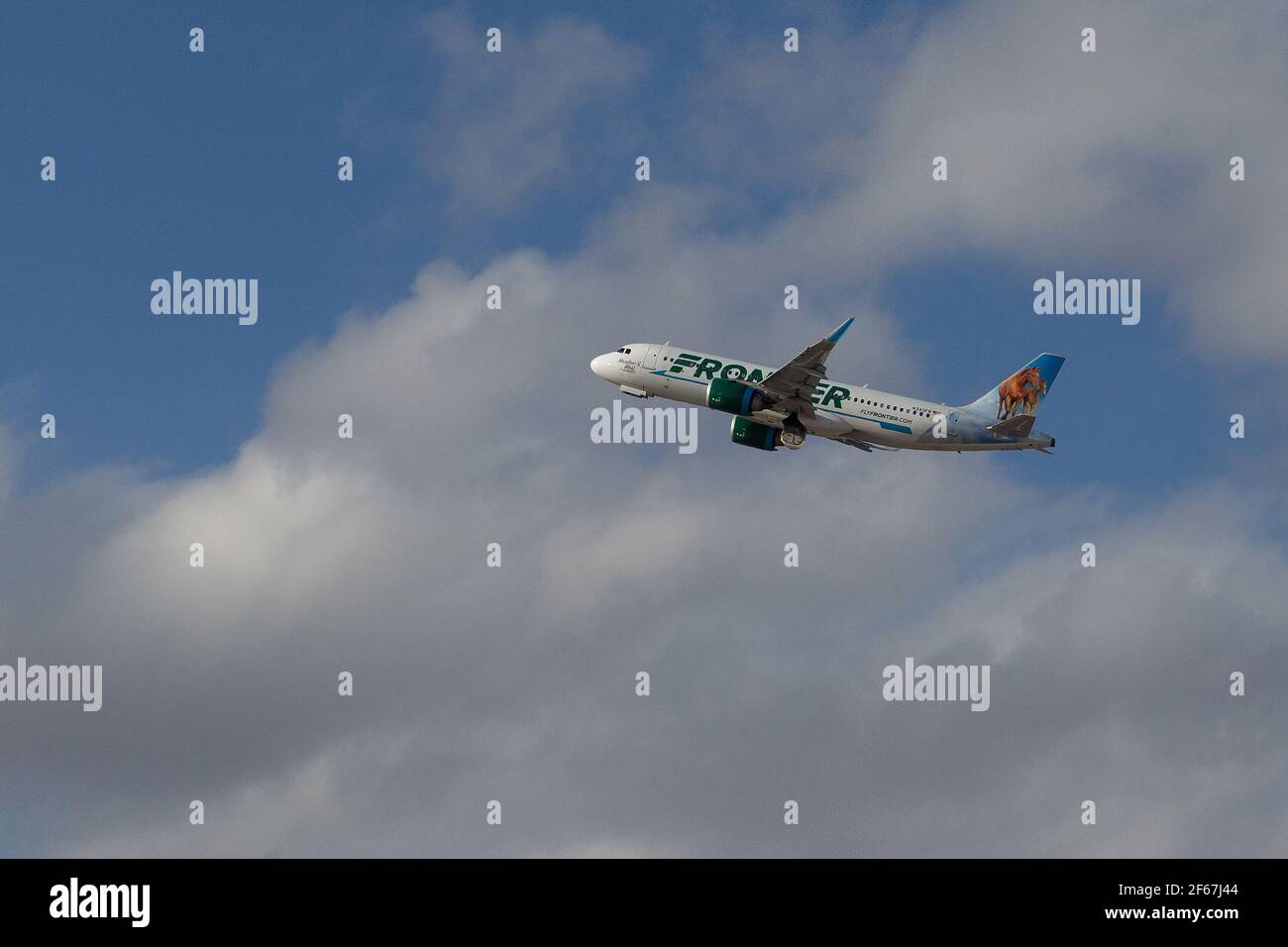Frontier Airlines plane taking off from Denver International Airport ...