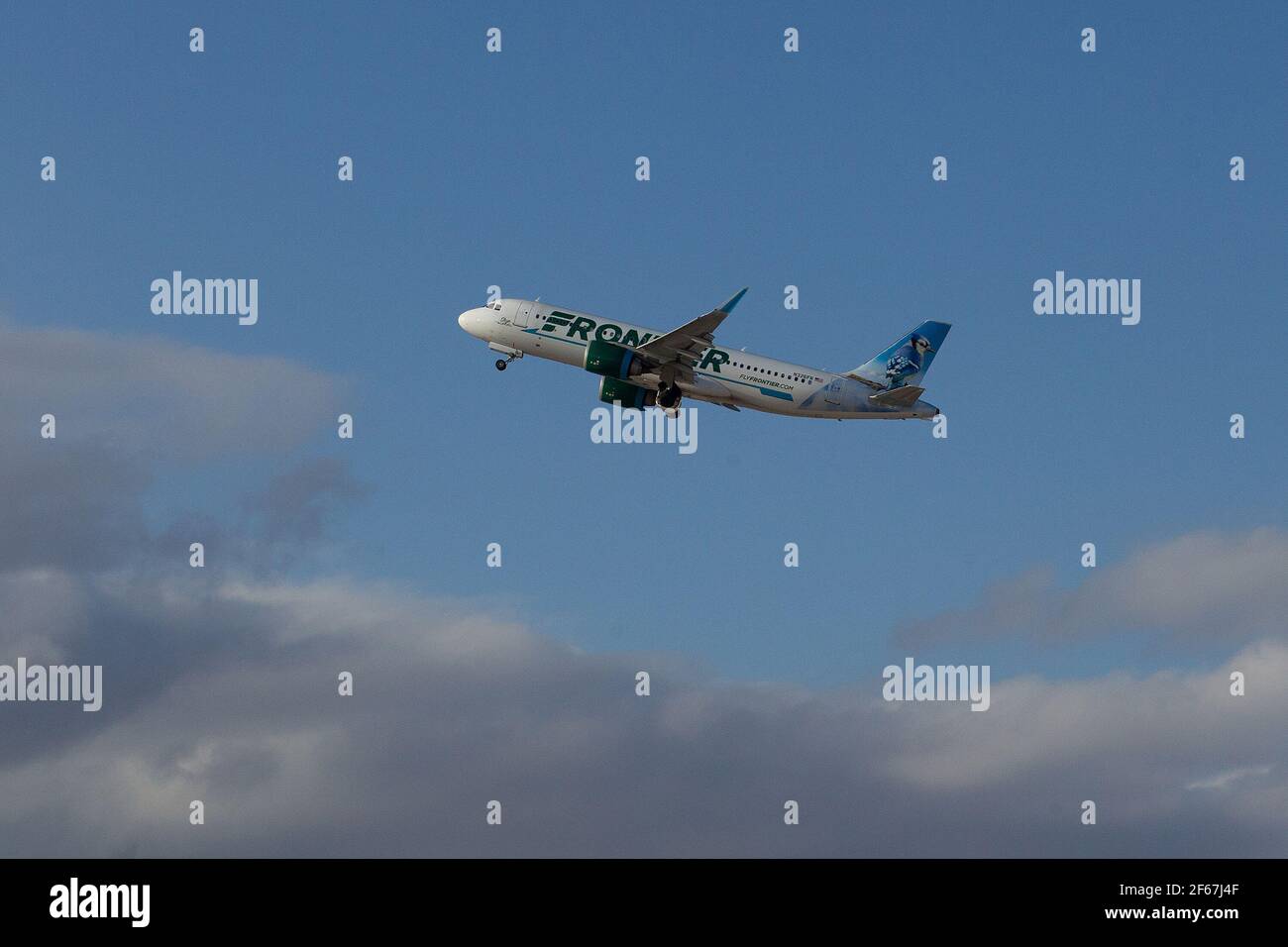 Frontier Airlines plane taking off from Denver International Airport ...