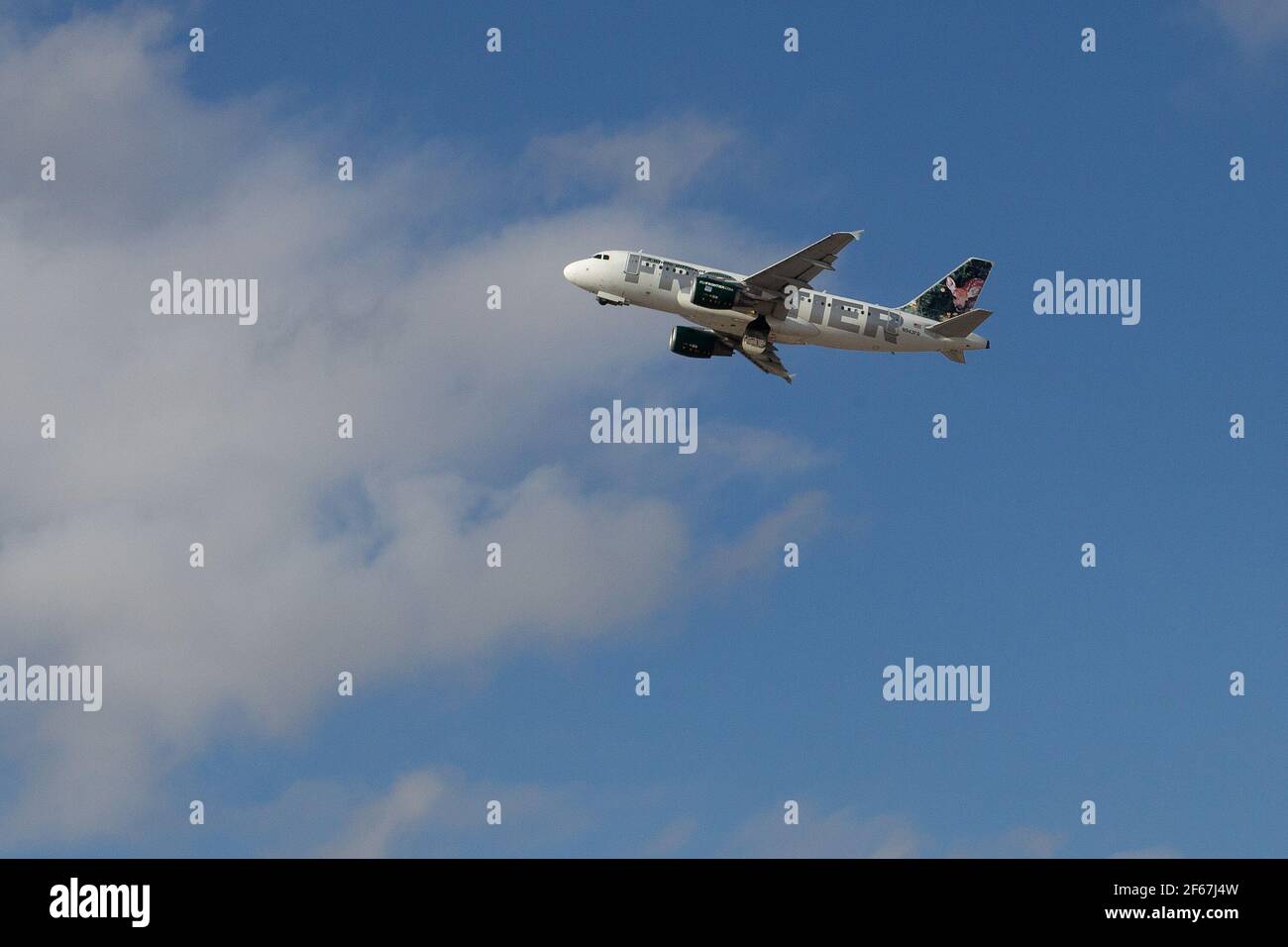 Frontier Airlines plane taking off from Denver International Airport ...
