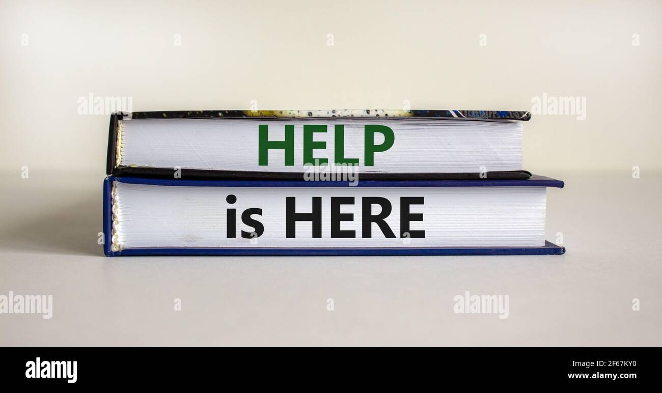 Help is here symbol. Books with words 'Help is here' on beautiful white ...