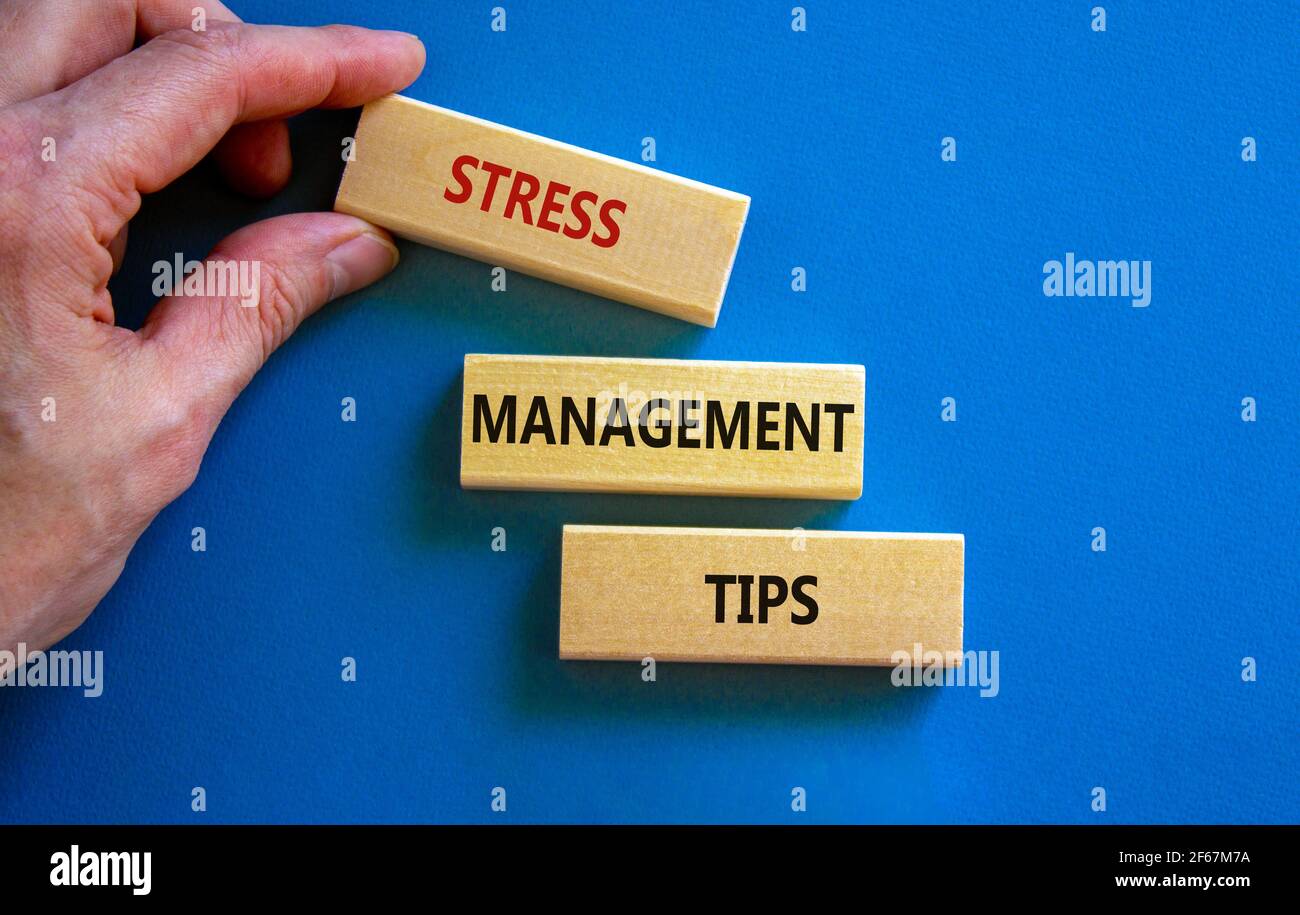 Stress management tips symbol. Wooden blocks with words 'Stress ...