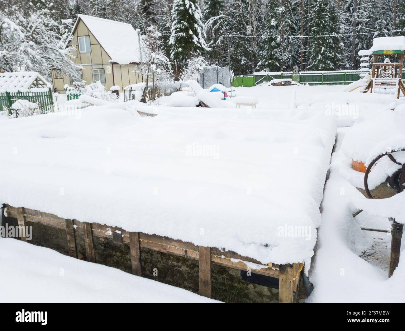 abandoned empty messy backyard, covered with snow Stock Photo - Alamy