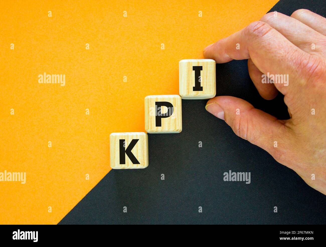 KPI, key performance indicator symbol. Wood cubes with words 'KPI, key ...