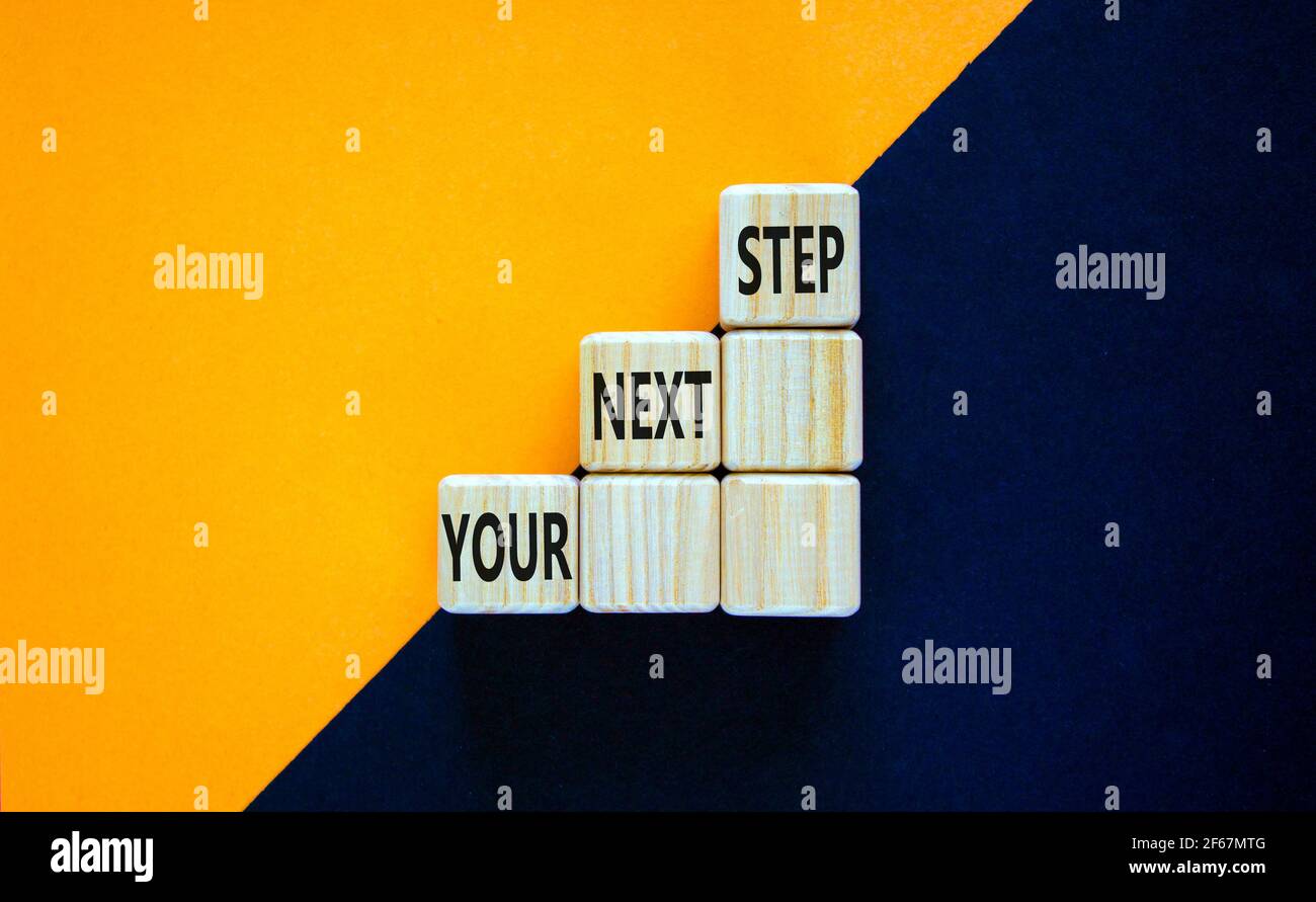 Your next step symbol. Wooden blocks stacking as step stair on top with ...