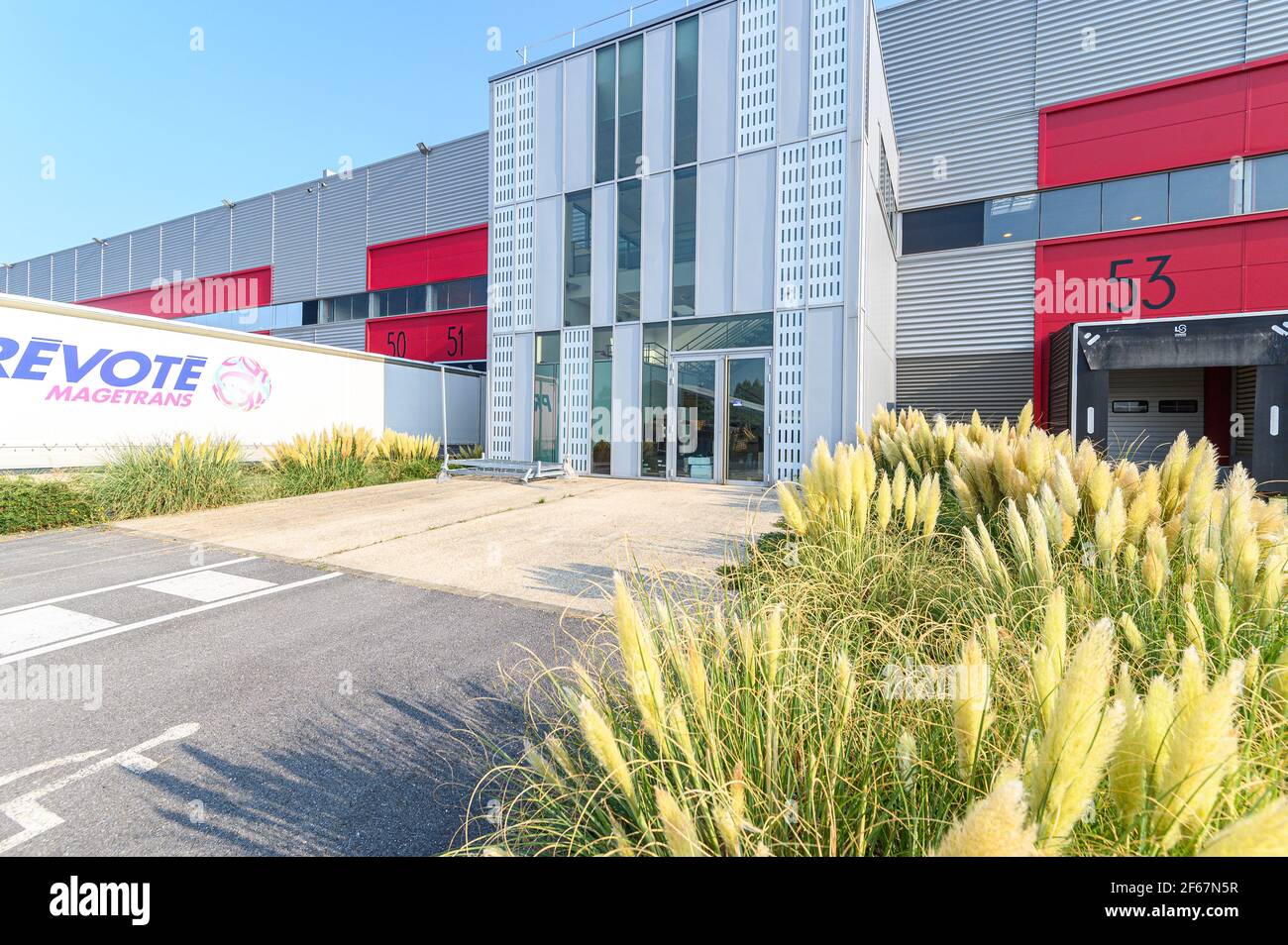 Logistic warehouse hall with modern metal facade. Loading bays and main ...