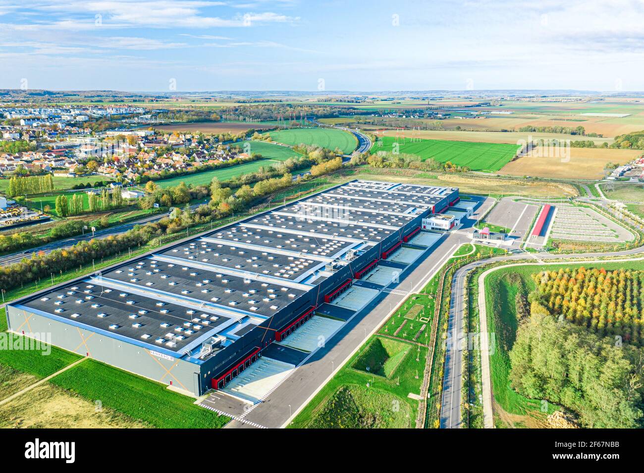 View of new logistic hall on suburbs. Empty parking and loading bays ...