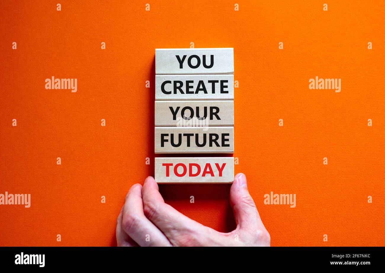 You create your future today symbol. Concept words 'You create your future today' on wooden ...