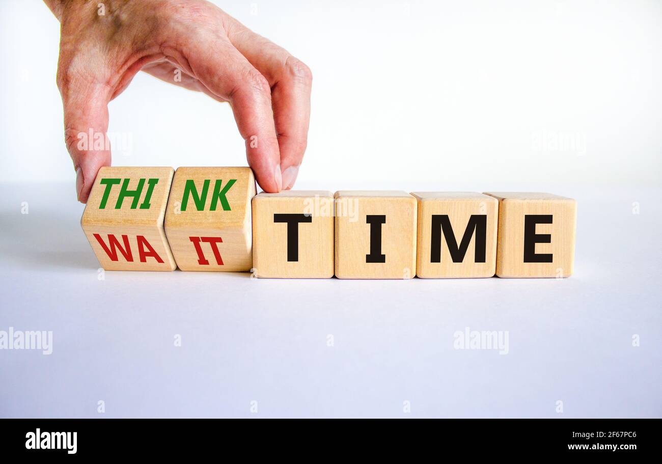 Think or wait time symbol. Businessman turns wooden cubes and changes ...