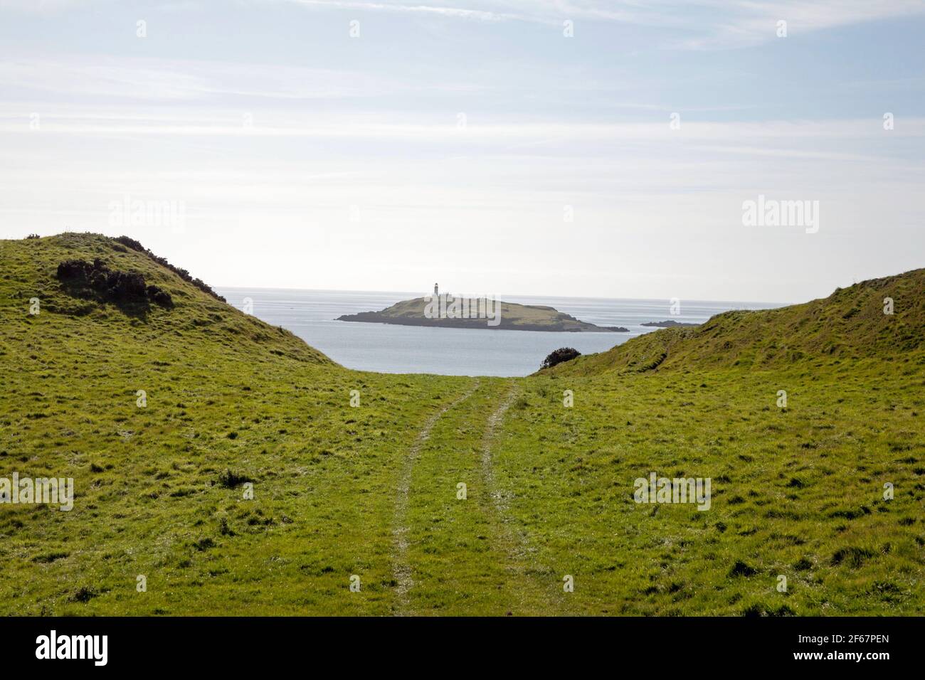 Little Ross Island and lighthouse viewed from Torrs Point at the mouth ...